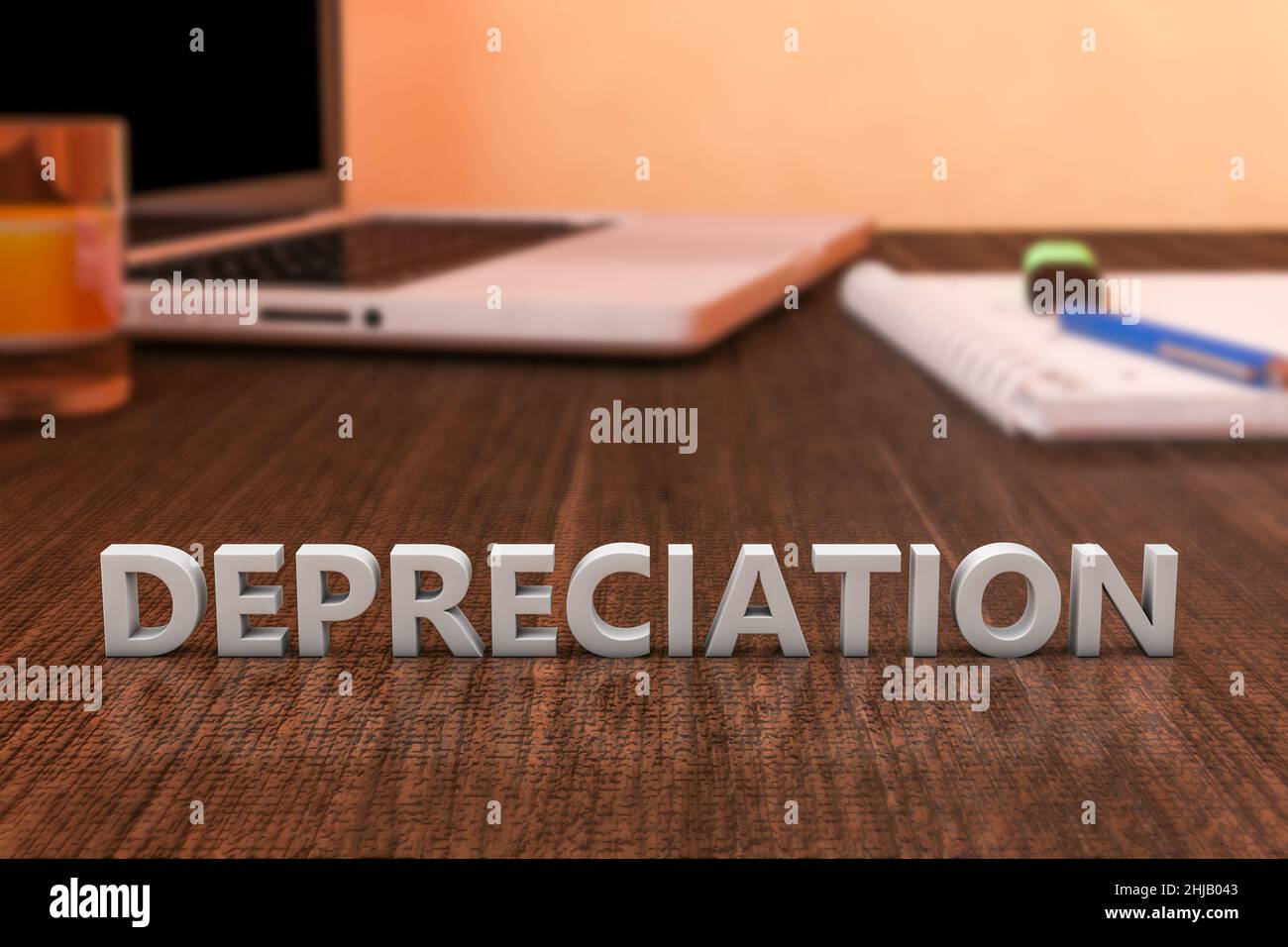 Depreciation - letters on wooden desk with laptop computer and a ...