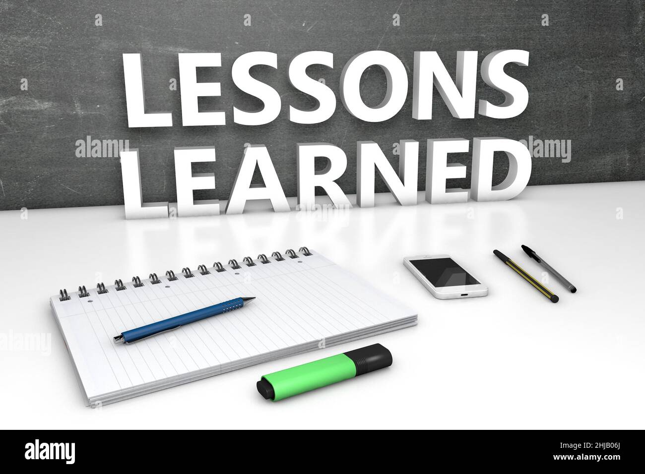 Lessons Learned - text concept with chalkboard, notebook, pens and ...