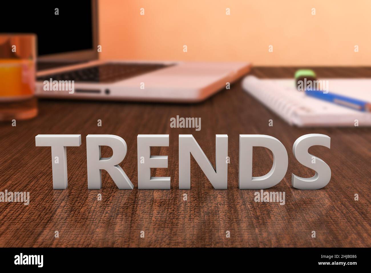 Trends - letters on wooden desk with laptop computer and a notebook. 3d ...