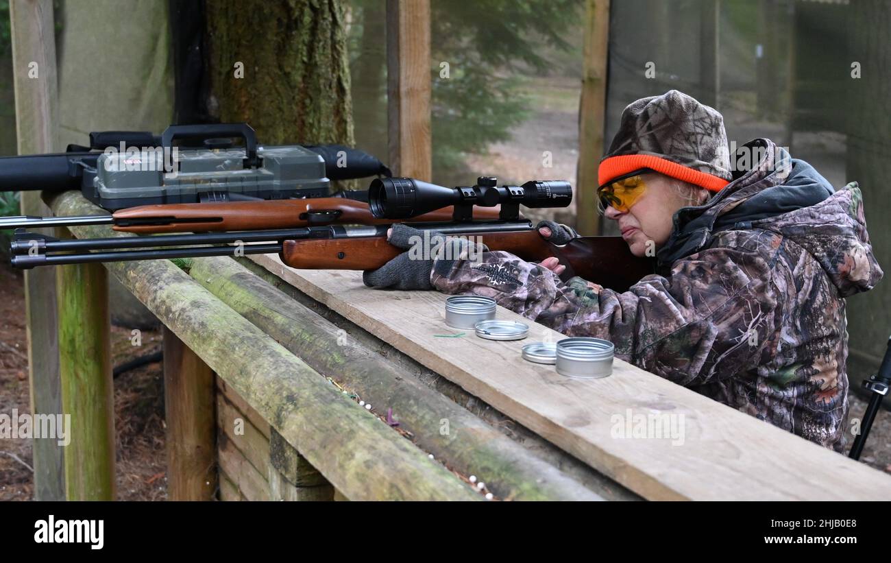 A female sharp shooter on a shooting range Stock Photo - Alamy