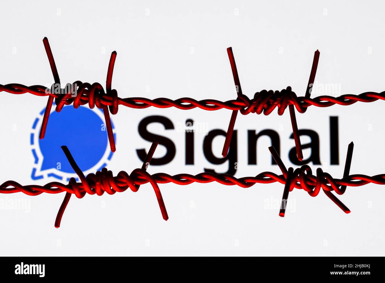 Signal encrypted instant messaging service logo behind barbed wire. The ... Signal encrypted instant messaging service logo behind barbed wire. The ...