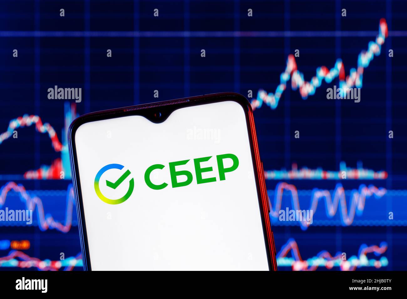 Smartphone with Sberbank logo. Sber stock chart on the background Stock ...
