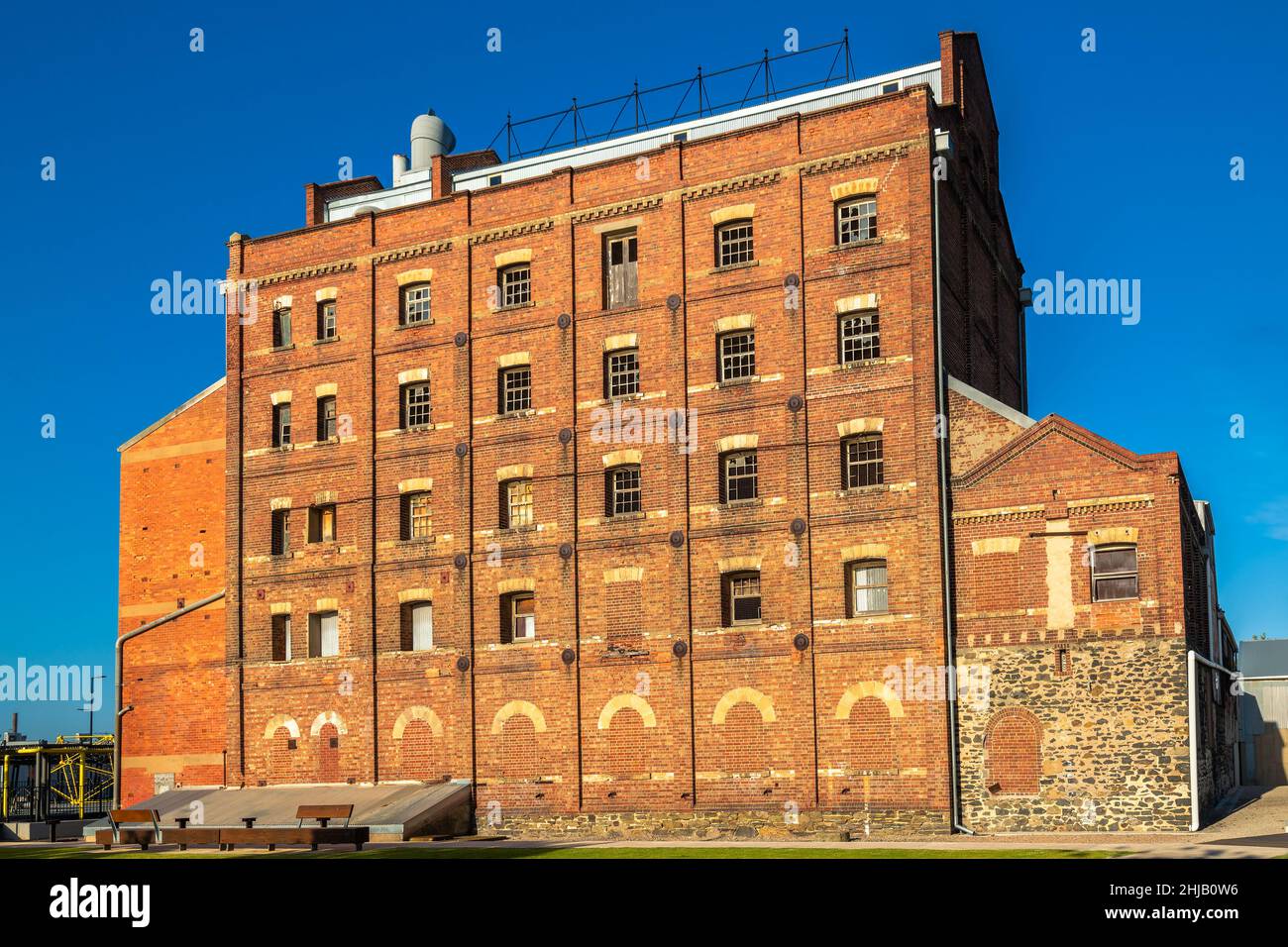 Old Hart's Mill building lit up by the afternoon sun in Port Adelaide ...