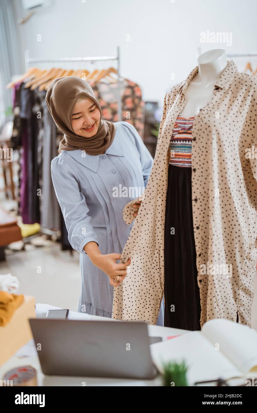muslim fashion designer in office working Stock Photo - Alamy