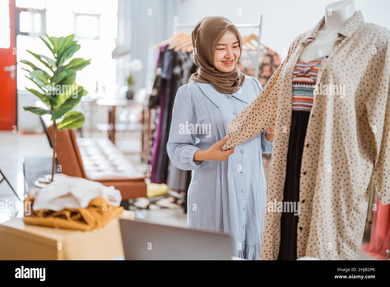 muslim fashion designer in office working Stock Photo - Alamy
