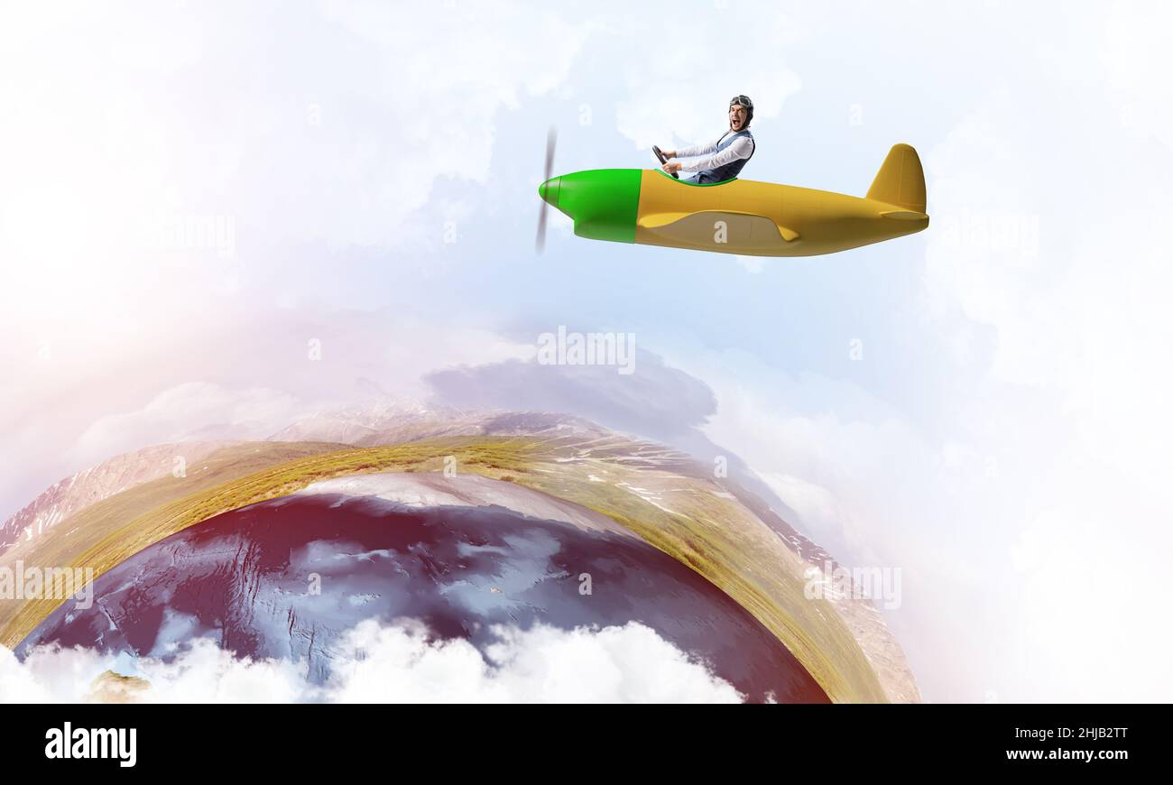 Aviator in leather helmet driving small plane Stock Photo - Alamy