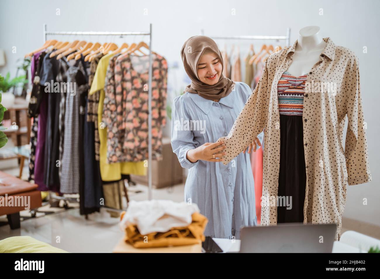 muslim fashion designer in office working Stock Photo - Alamy