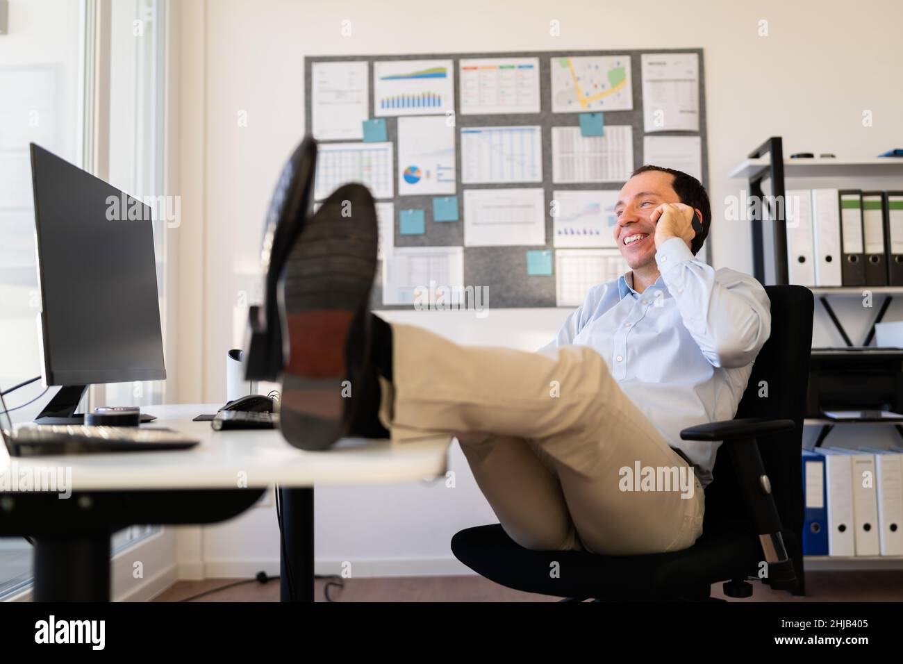 Caucasian young man types mobile hi-res stock photography and images ...