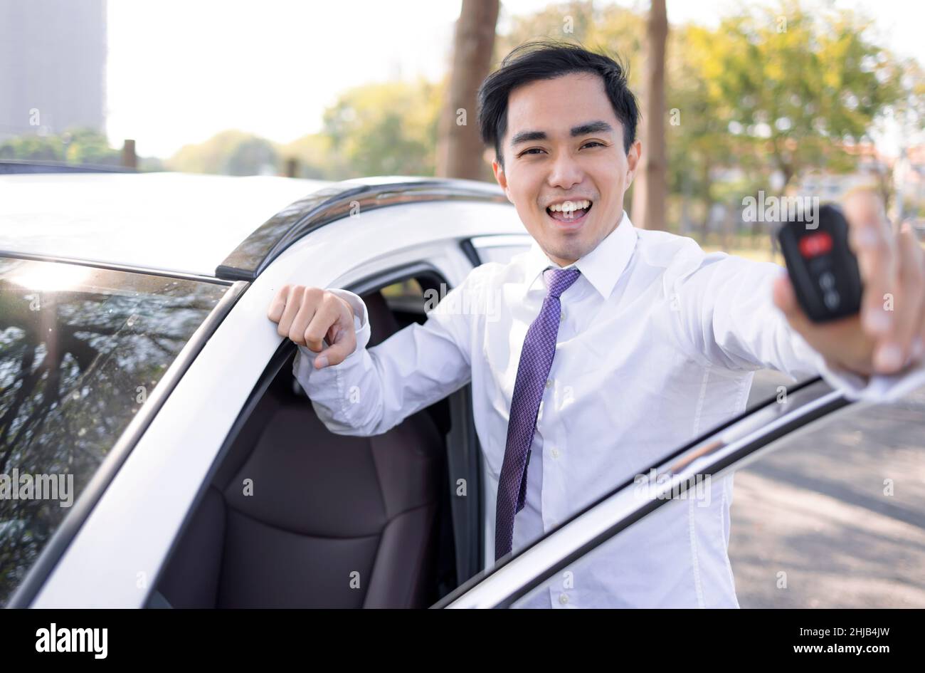 Young guy showing keys hi-res stock photography and images - Alamy