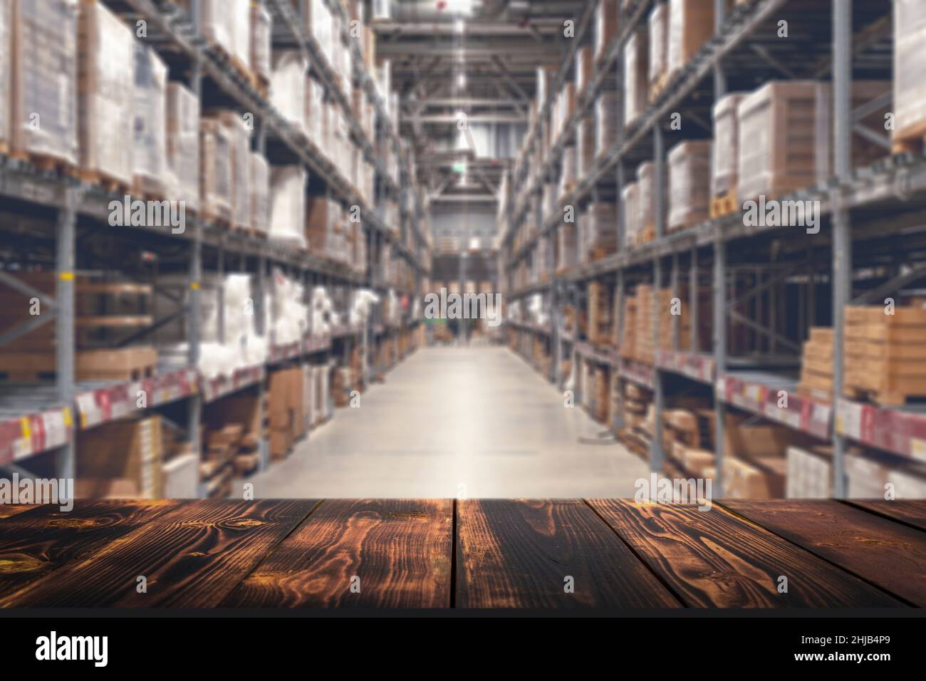 Warehouse with empty table background for product. Blurred industrial ...