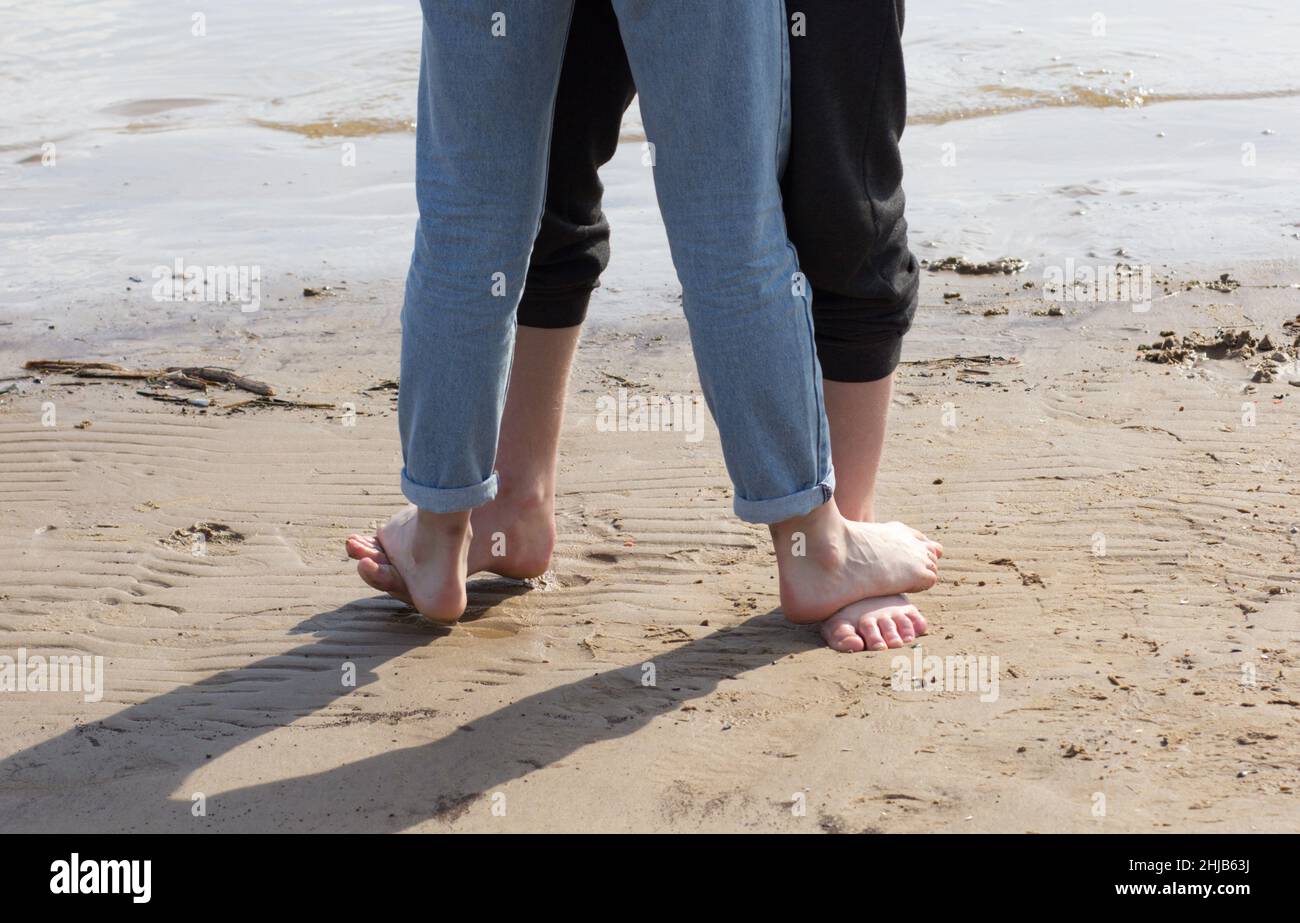 Family feet on sand hi-res stock photography and images - Alamy