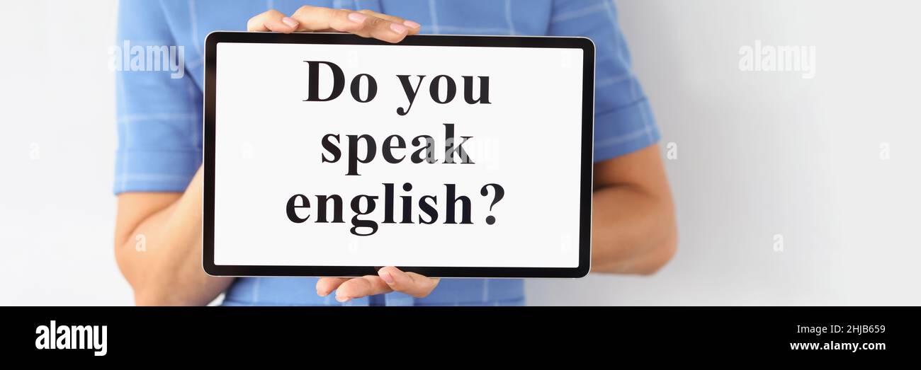 In women hands tablet with inscription You speak English. Mobile ...