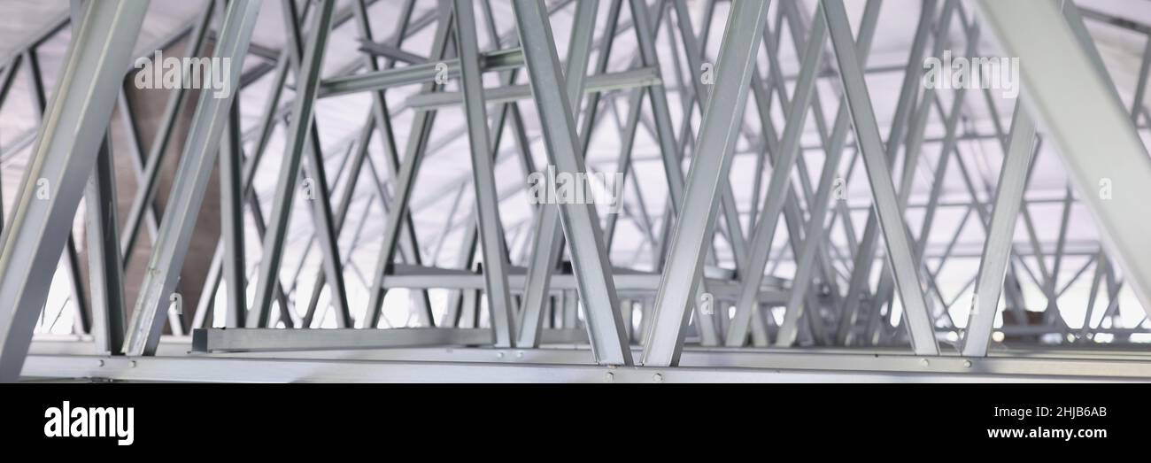Structure of steel roof frame for building construction closeup Stock ...