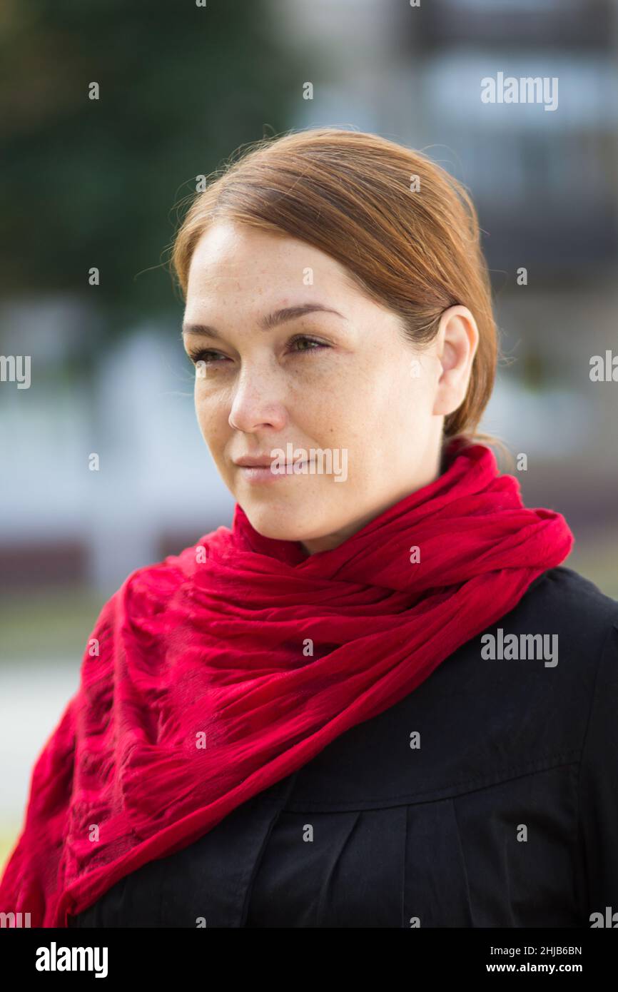 Portrait of caucasian middle aged woman looking aside with soft look ...