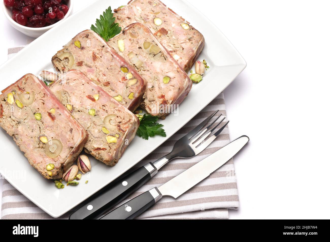 Sliced Traditional French terrine covered with bacon isolated on white ...