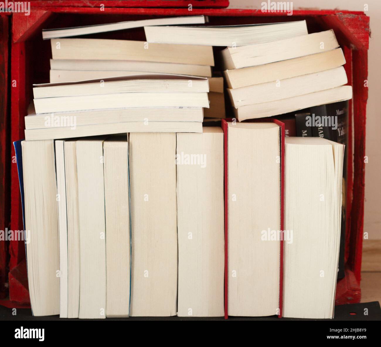 stack of books in home interior Stock Photo - Alamy