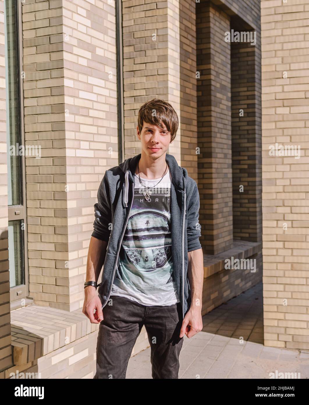 Young adult rock musician, looking at camera, singer wearing a blue ...