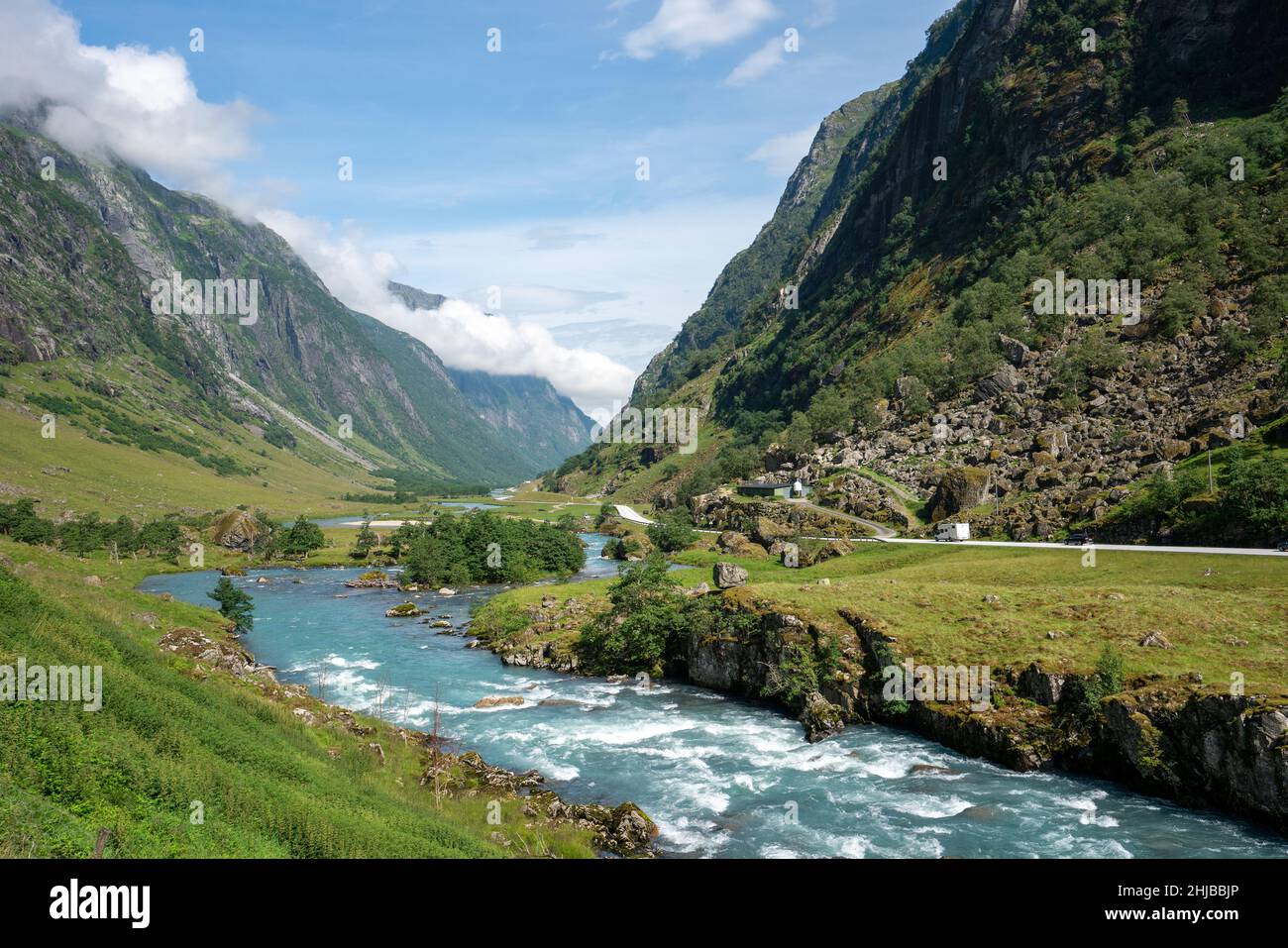 Norwegian valley with mountain ranges and flowing turquoise water Stock ...
