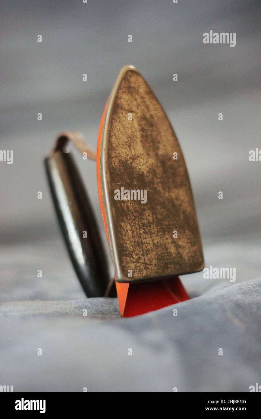 Vintage metal toy iron for kids to practice their domestic chores Stock ...