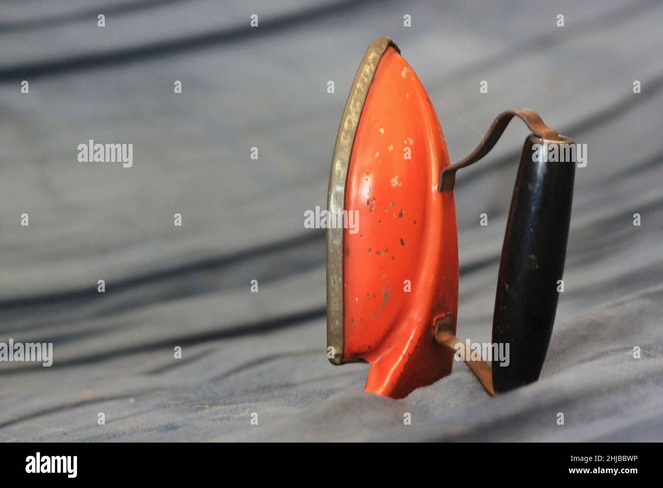 Vintage metal toy iron for kids to practice their domestic chores Stock ...