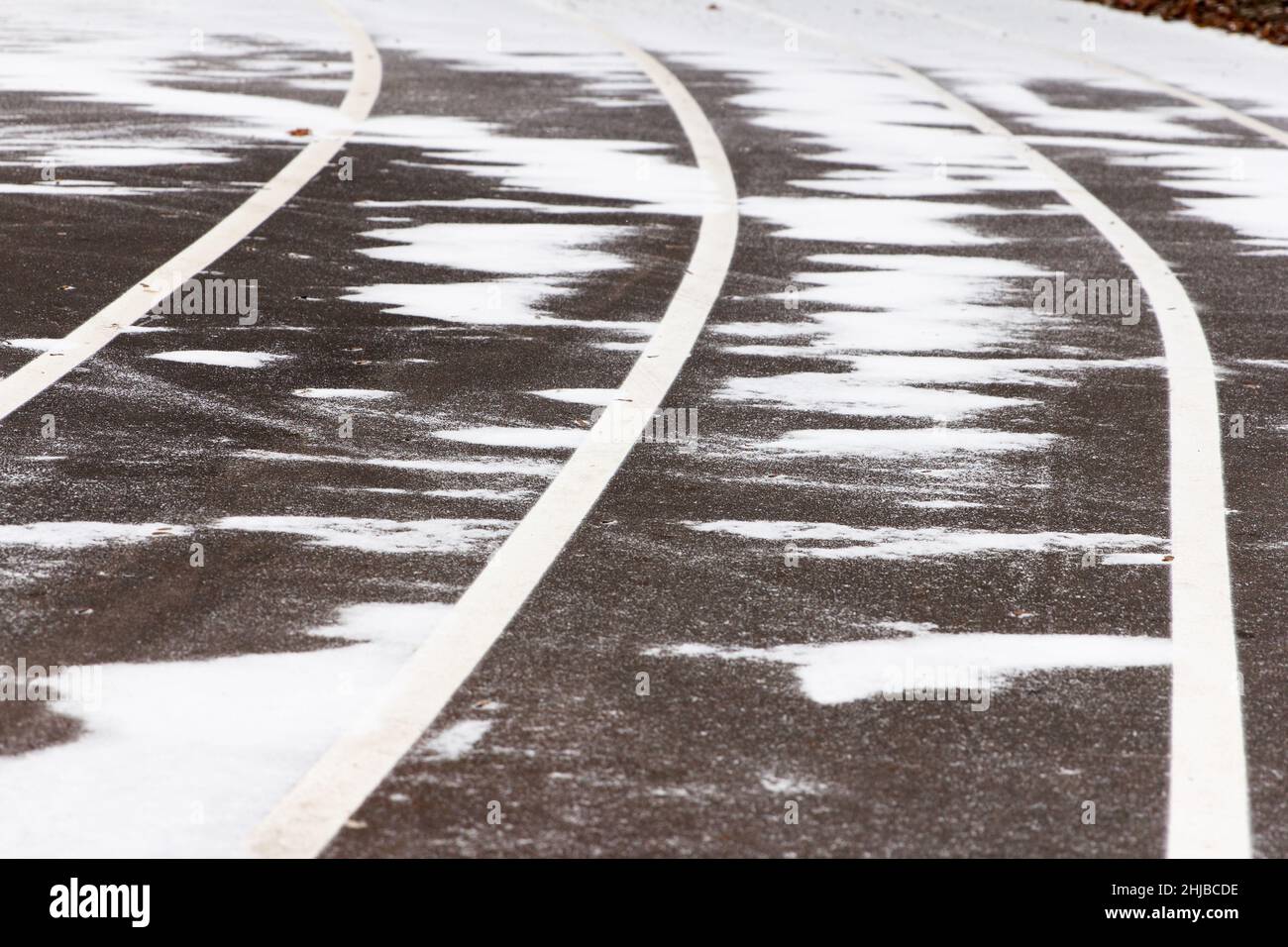 New treadmill, paved, with markings for runner athletes. In winter in ...