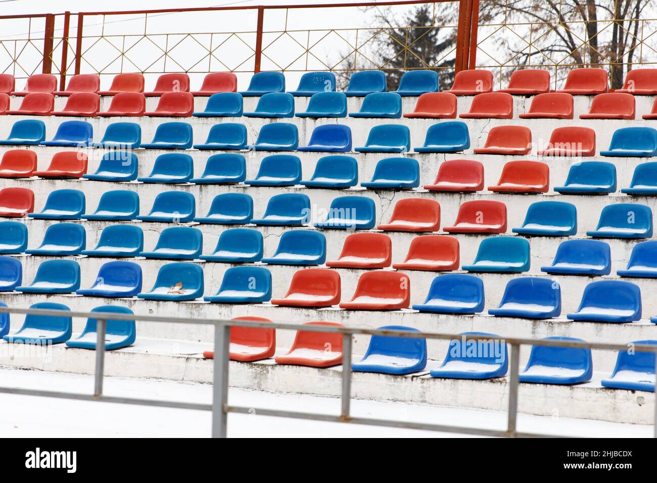 Places where fans sit, plastic red and blue chairs in a football ...