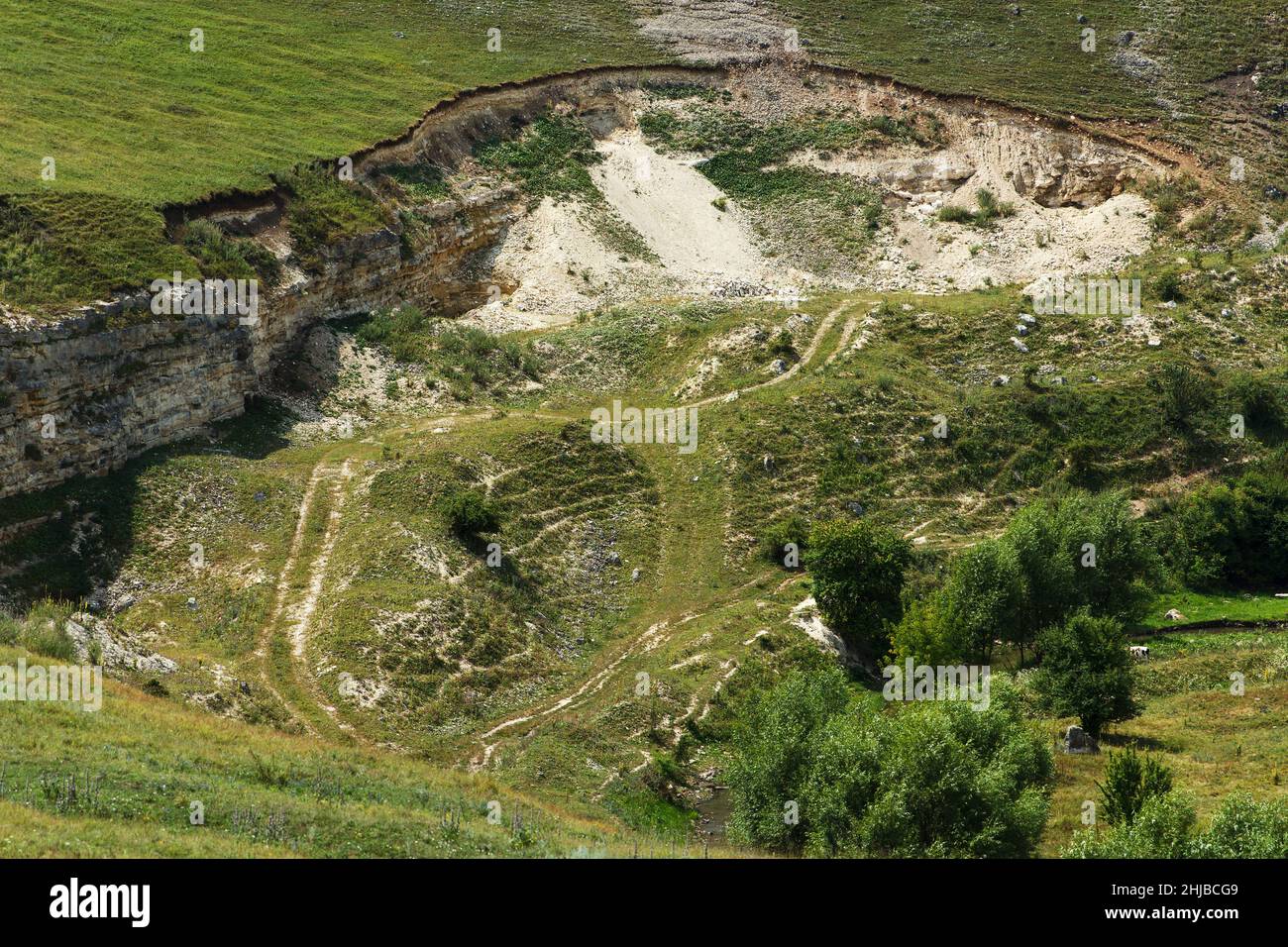 Beautiful natural gorge strewn with hills, grass and trees. Stunning ...