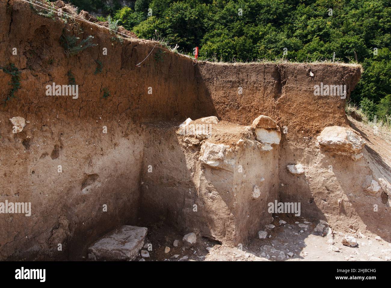 Archaeologists dug a hole on hillside to search for historical ...