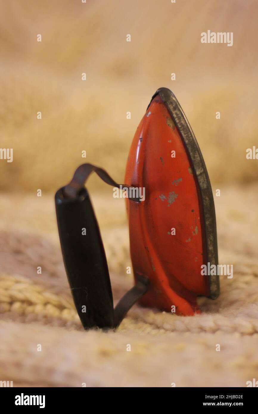 Vintage metal toy iron for kids to practice their domestic chores Stock ...
