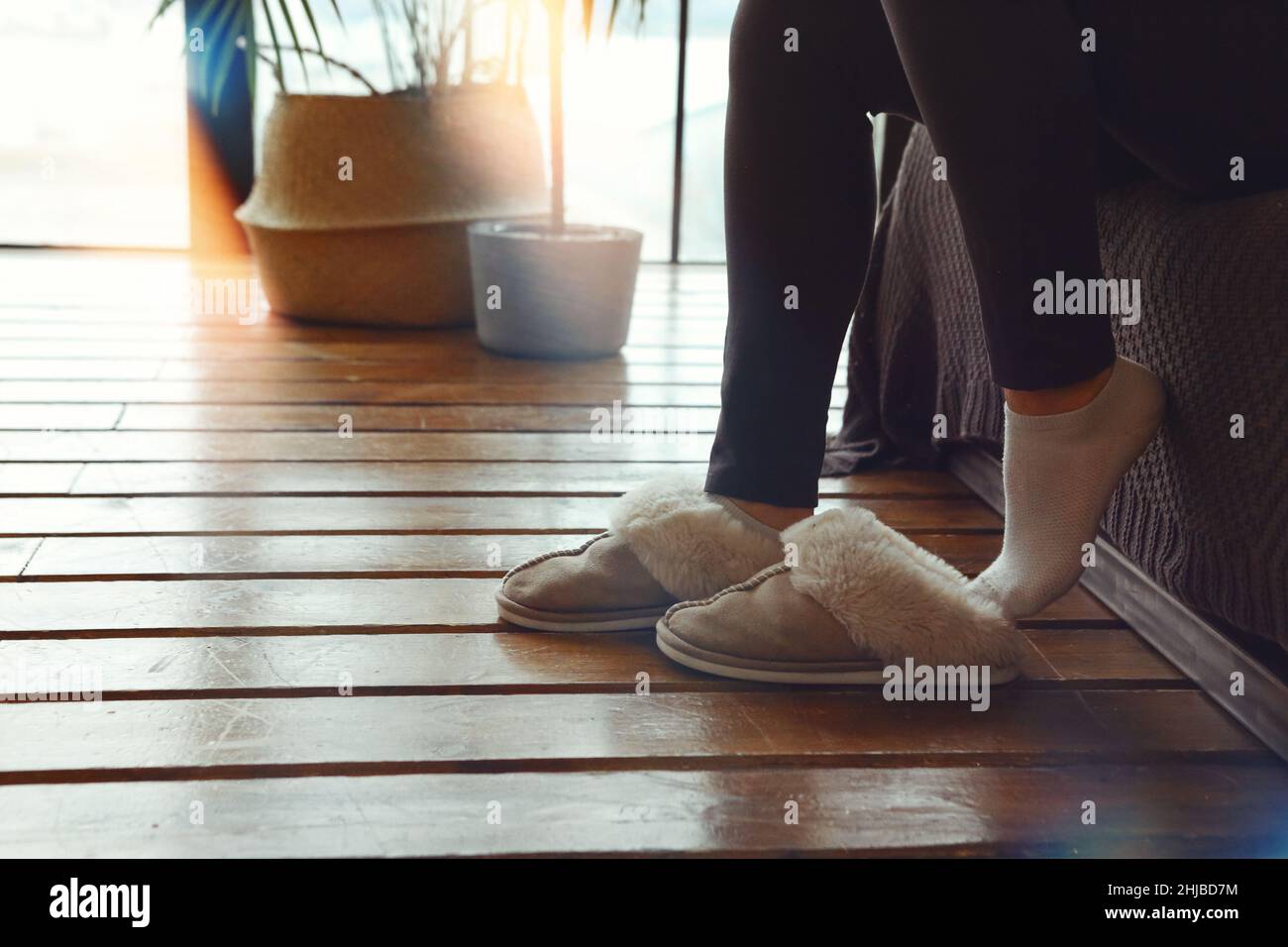 Woman wearing slippers hi-res stock photography and images - Alamy