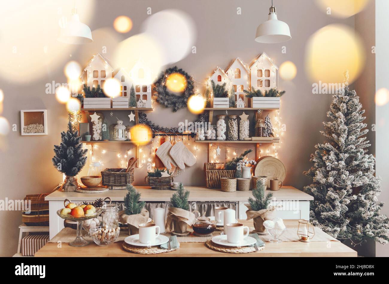 Cozy Christmas home. Beautiful festive kitchen interior with with glass ...