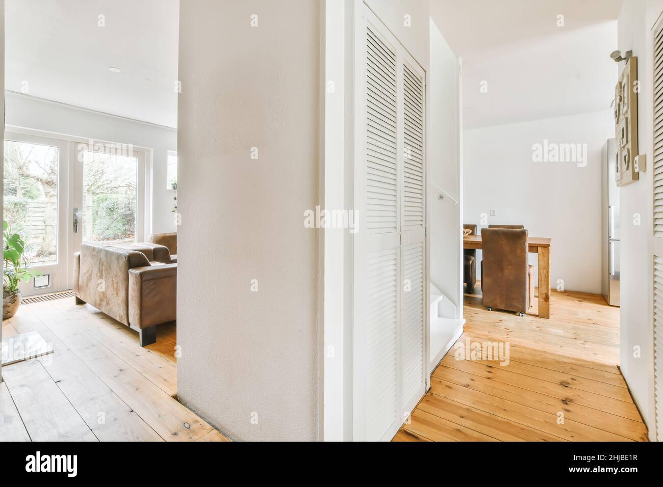 Cute hallway connecting the living room and dining room Stock Photo - Alamy