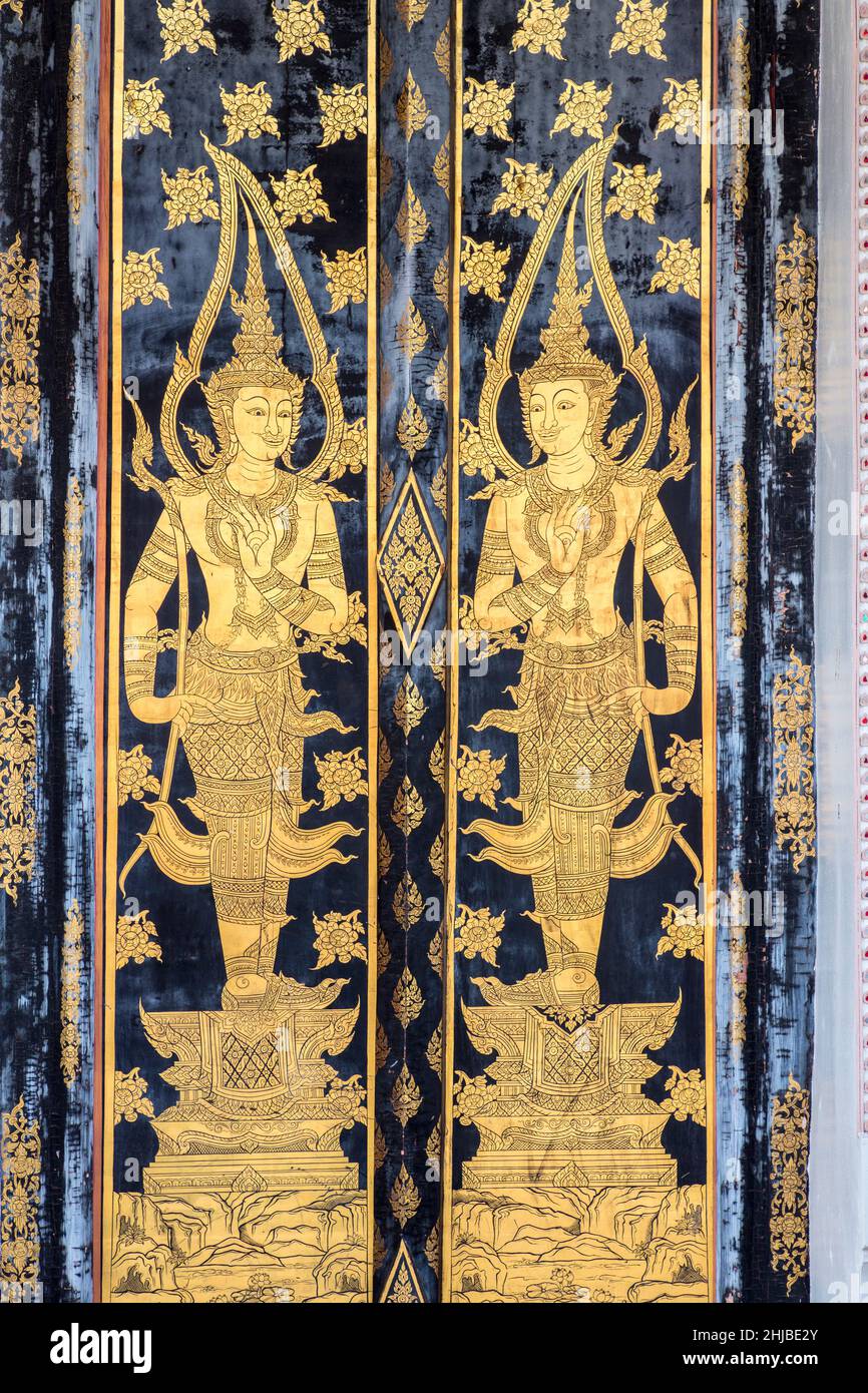 Inlaid gold illustrations in panel, Wat temple, Bangkok, Thailand Stock ...