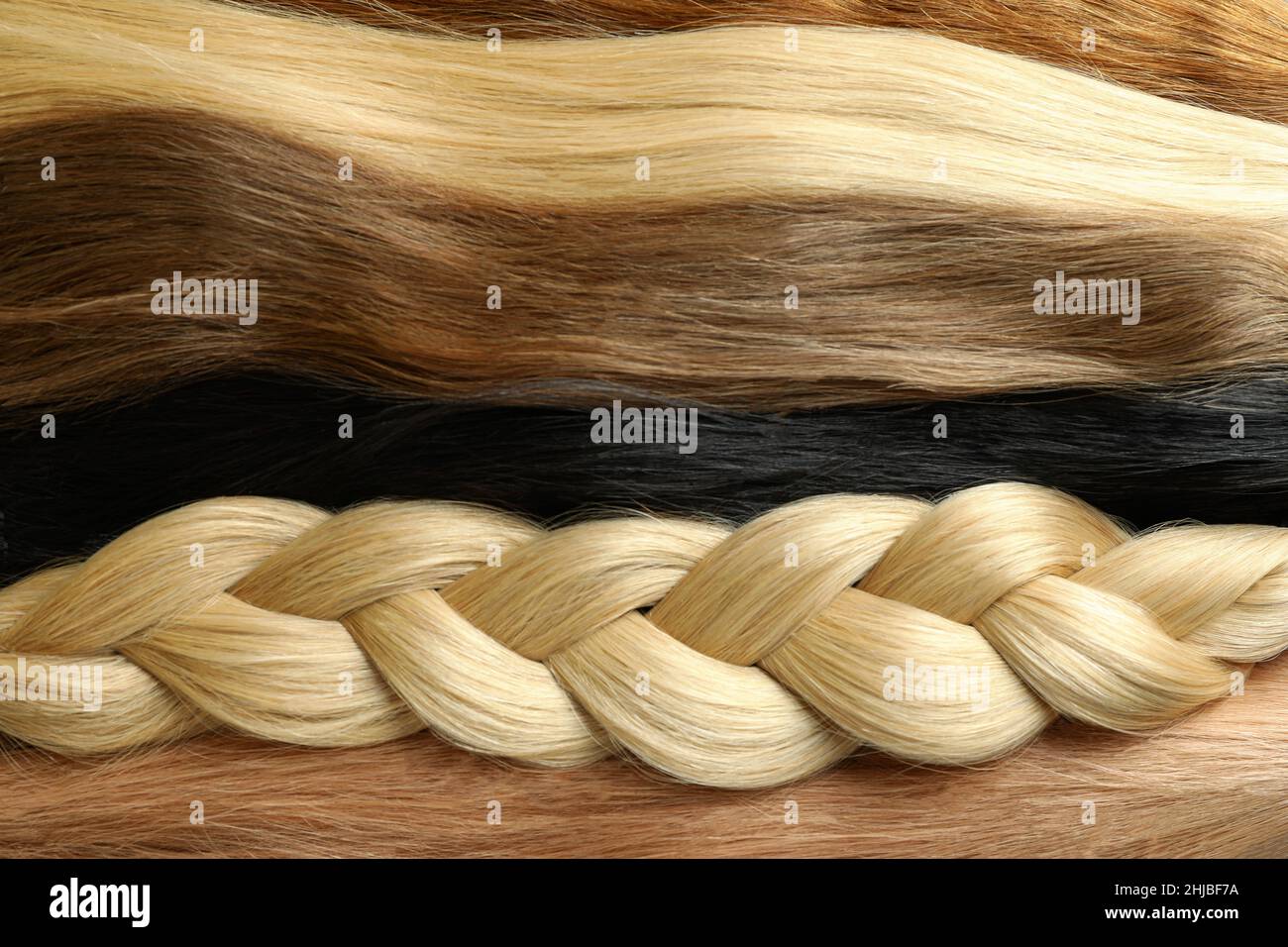 Different color female hair on whole background, close up Stock Photo ...