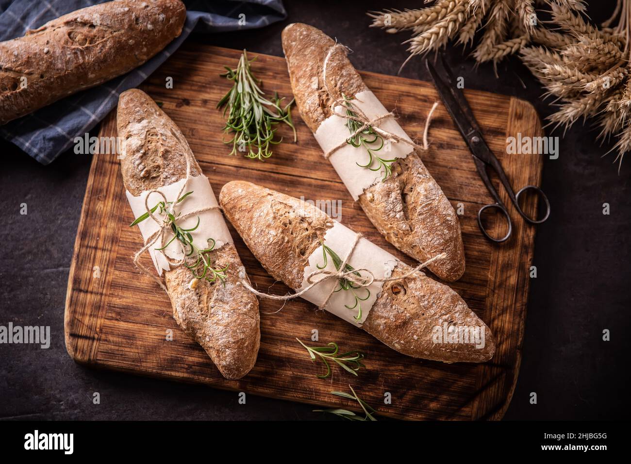 Tope view of freshly baked pastry bread on a vintage wooden board with ...