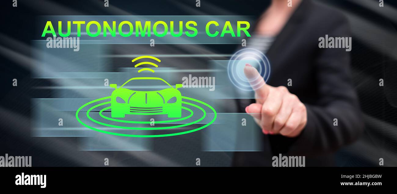 Woman touching an autonomous car concept on a touch screen with her ...