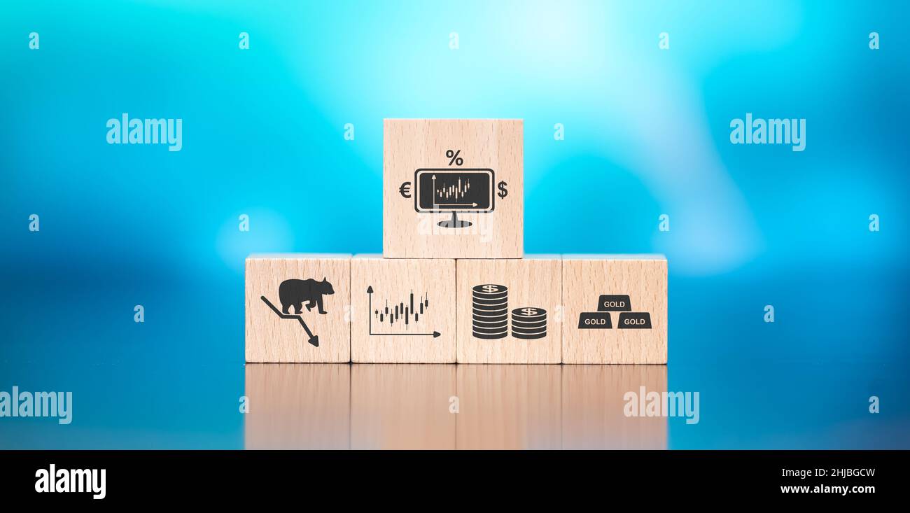 Wooden blocks with symbol of stock exchange concept on blue background ...