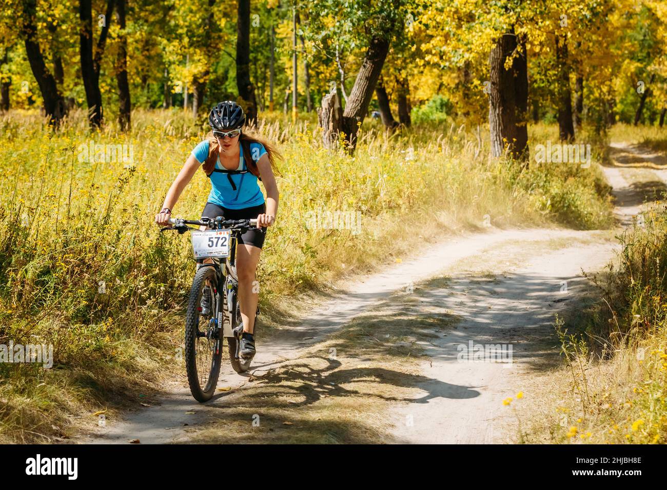 Female athlete riding bicycle hi-res stock photography and images - Alamy