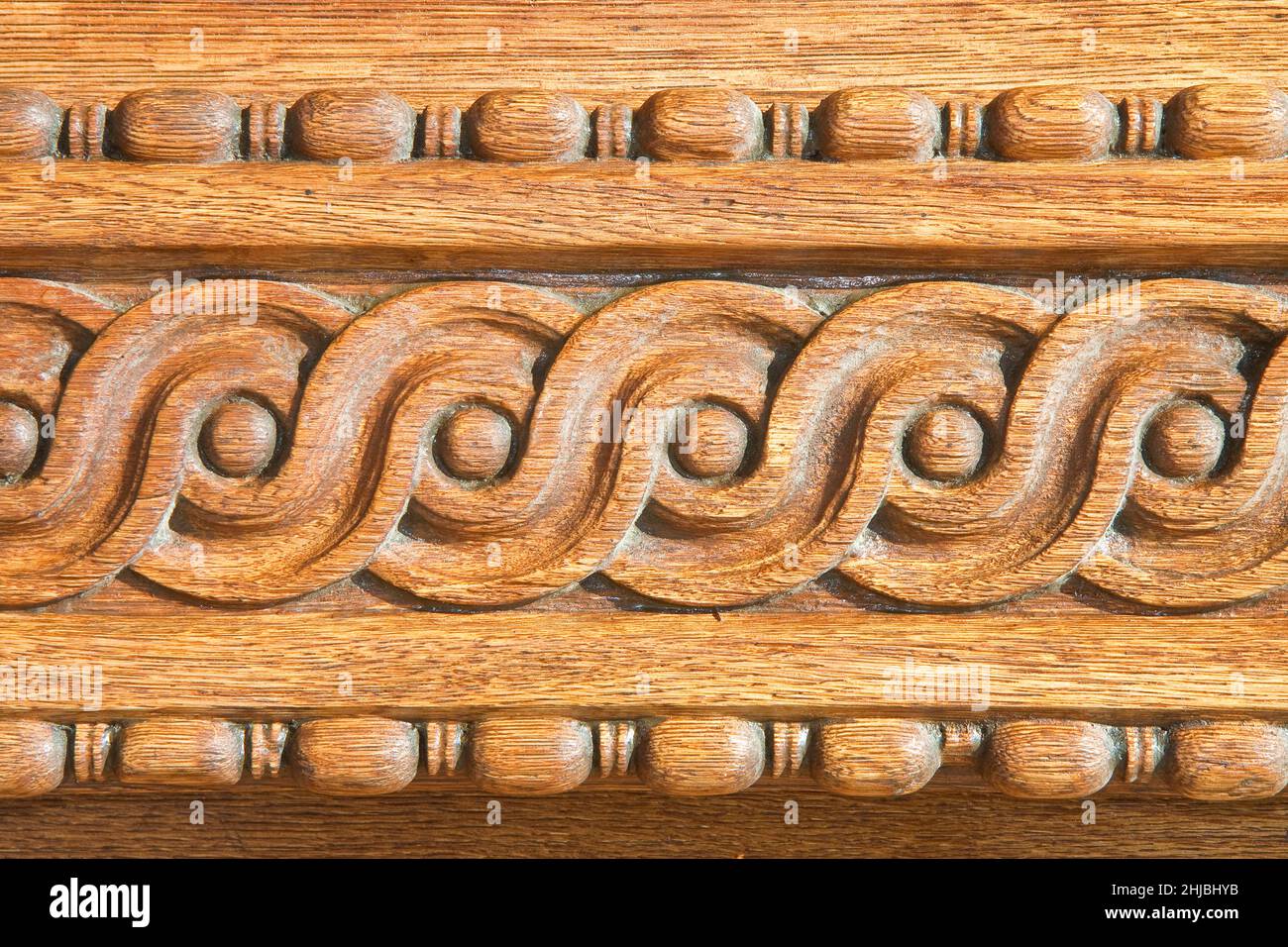 Old carved wooden frame with geometric and circular decorations shape ...