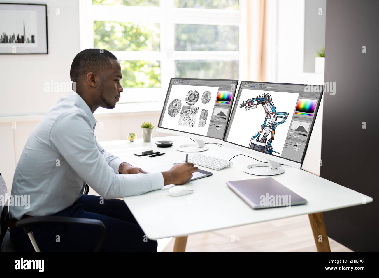 African Graphic Web Designer Using Design Editing Software Stock Photo ...