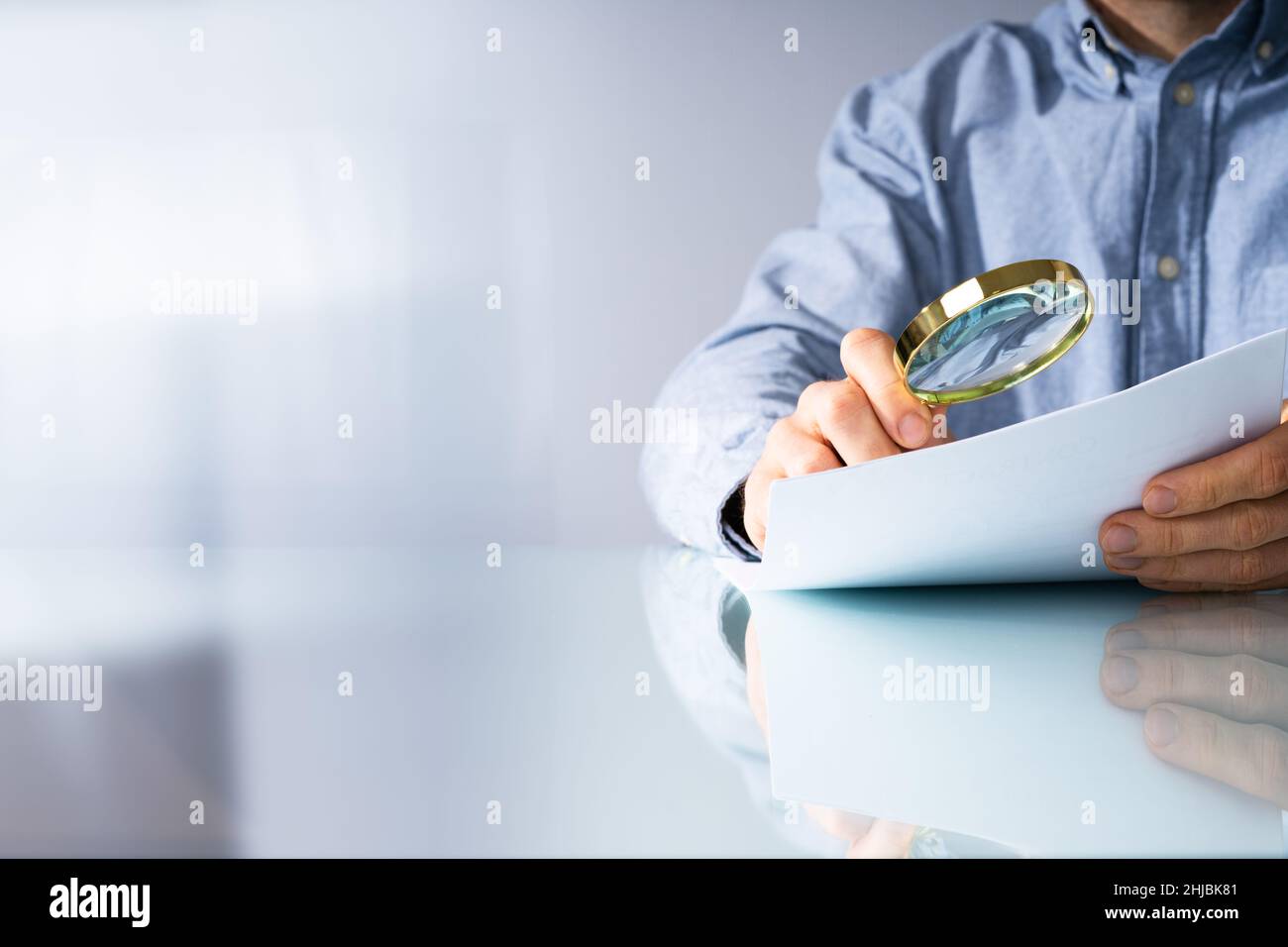 Auditor Using Magnifying Glass For Audit And Fraud Investigation Stock ...