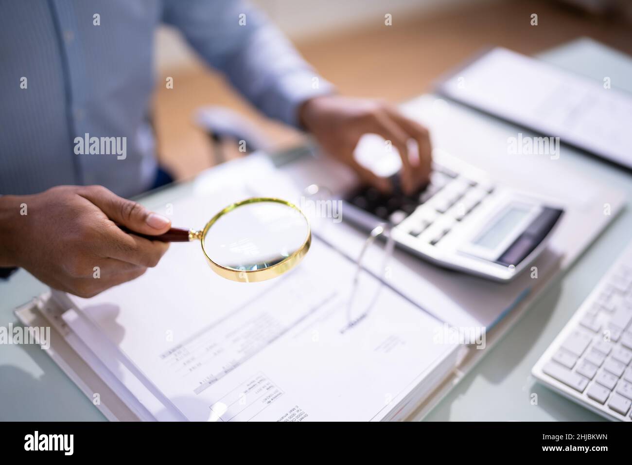 Auditor Using Magnifying Glass For Audit And Fraud Investigation Stock ...