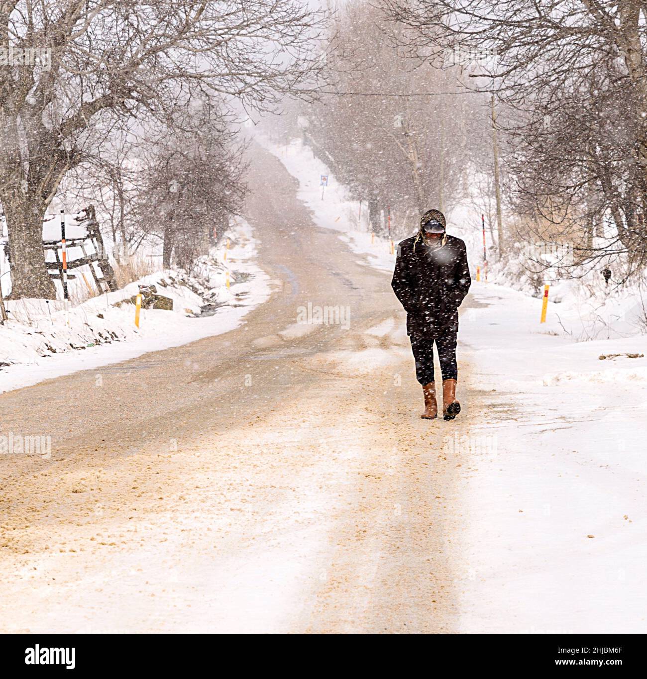 man walking cold in snow Stock Photo - Alamy