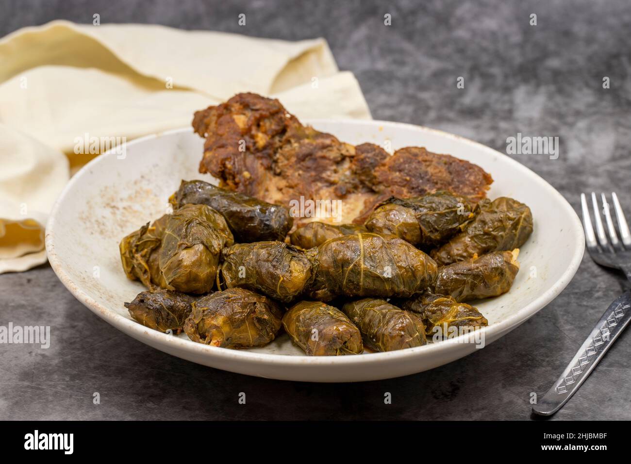 Meat leaf wrapping. Traditional Mediterranean flavor. Wrapping leaves ...