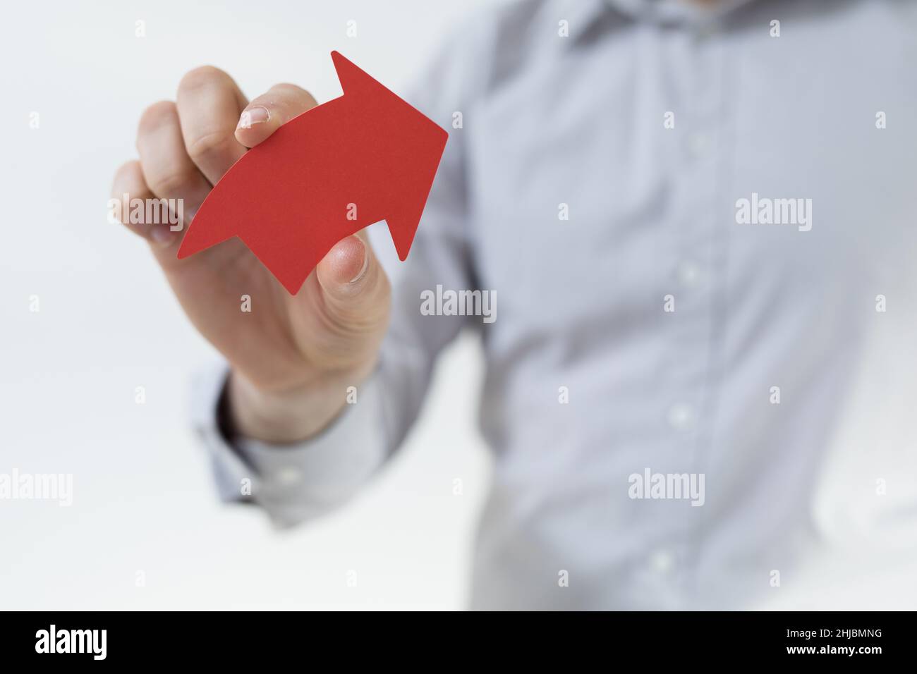 Closeup of a man holding an arrow Stock Photo - Alamy