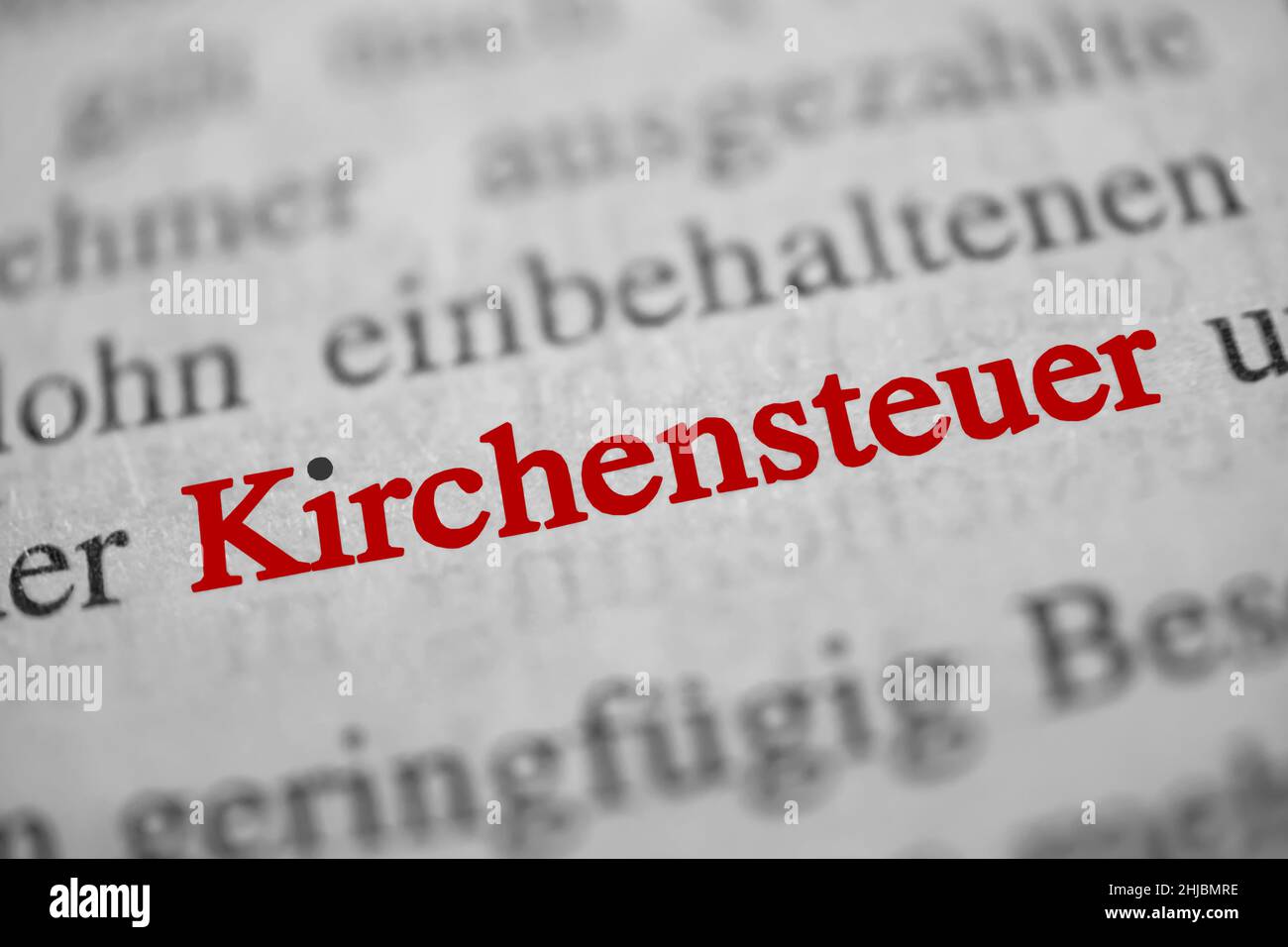 Closeup on the highlighted German word "Kirchensteuer" in a newspaper ...
