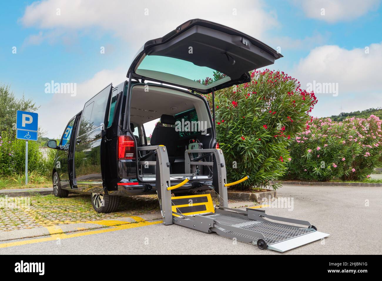Accessible van with wheelchair lift ramp for person with disability ...
