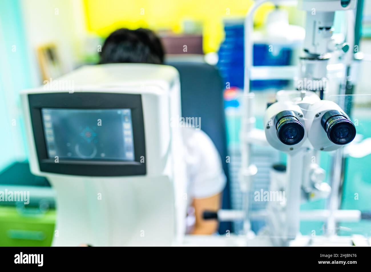 optometrist checking eyesight and vision correction on store Stock ...