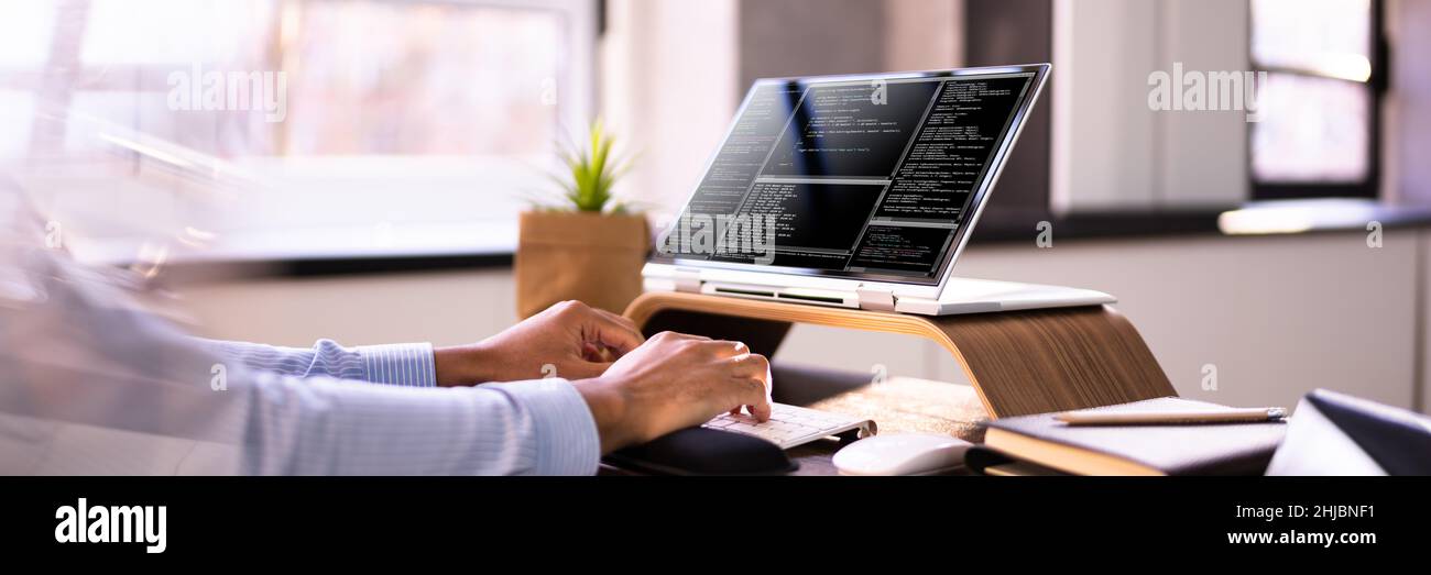 African American Coder Using Computer At Desk. Web Developer Stock ...