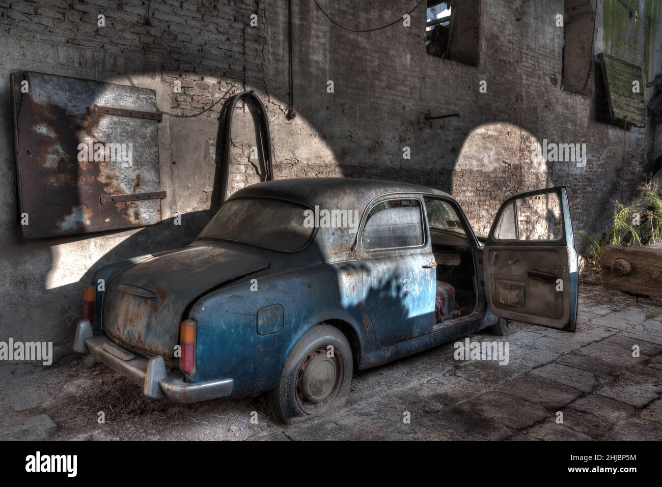January, 2022. Italy. Italian car abandoned for a long time under a ...